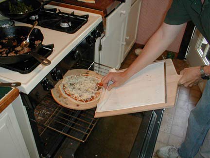 Tip For Getting Your Homemade Pizza to Slide Into the Oven | CulinaryLore