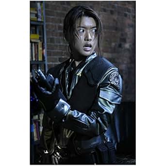 Lt. Sharon 'Boomer' Valerii in Hideout Holding Radio - Battlestar ...