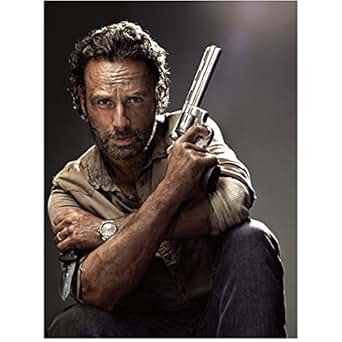 The Walking Dead Rick Grimes with gun in one hand and knife in the ...