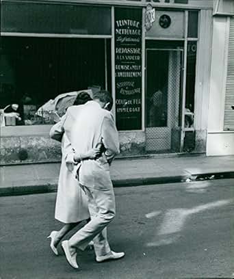 Amazon.com: Vintage photo of Nancy Kwan and Peter Pock walking on road ...