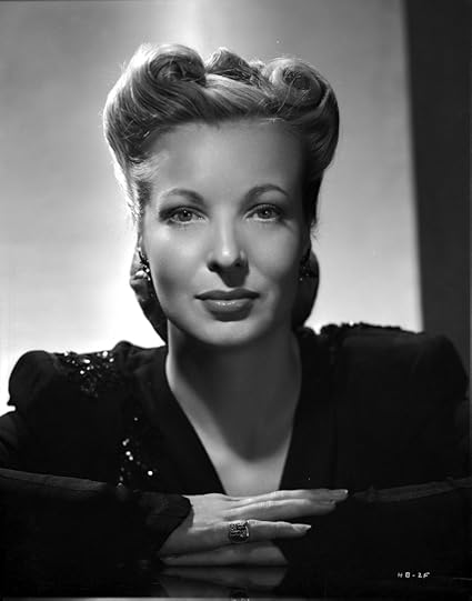 Amazon.com: Hillary Brooks Lying on Printed Beddings Photo Print (8 x ...