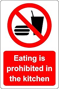 Señal de seguridad con texto en inglés "Eating is prohibited in the ...
