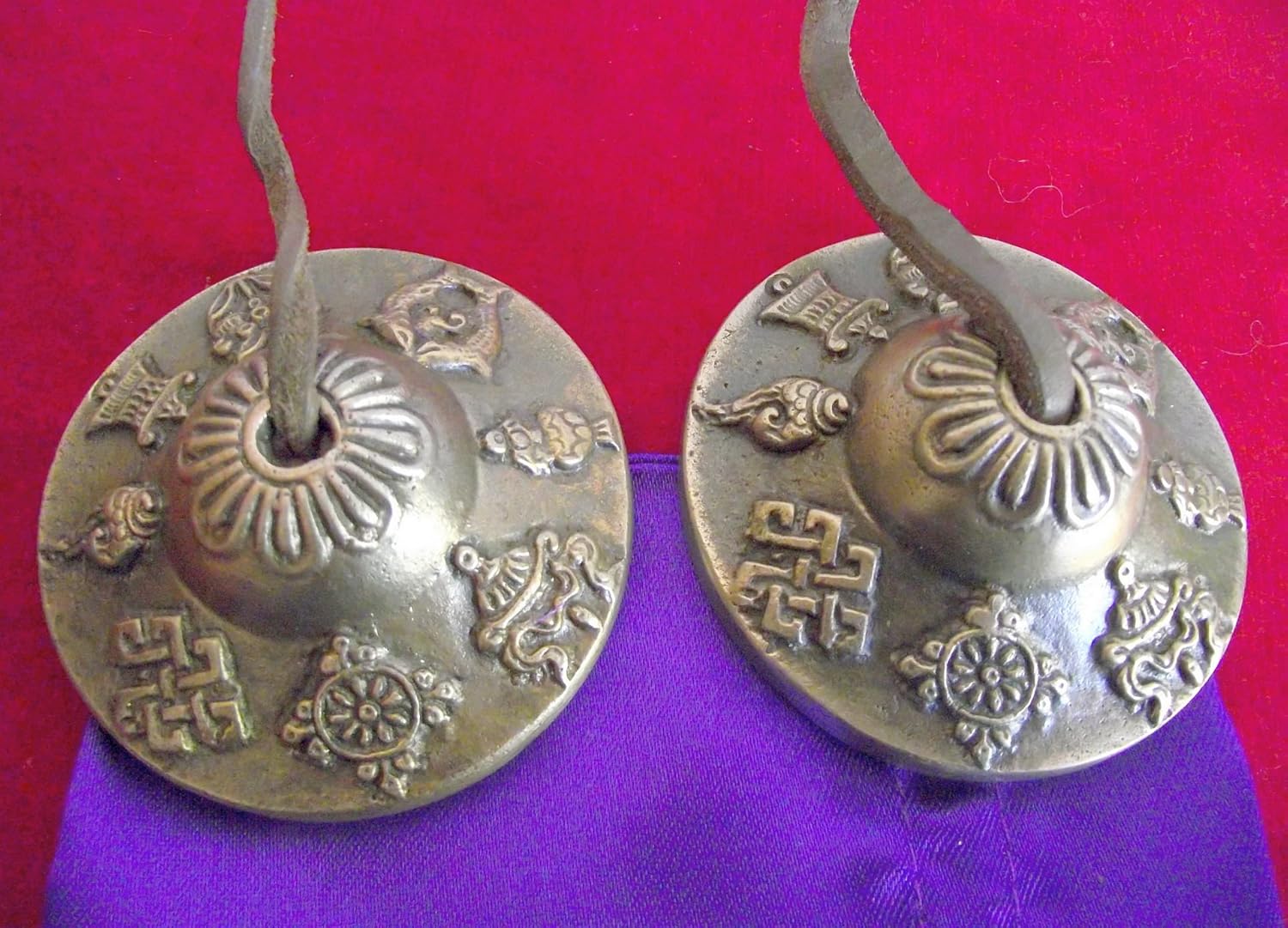 Tibetan Buddhist Astamangala Hand Bells on Leather Cord; embossed with ...