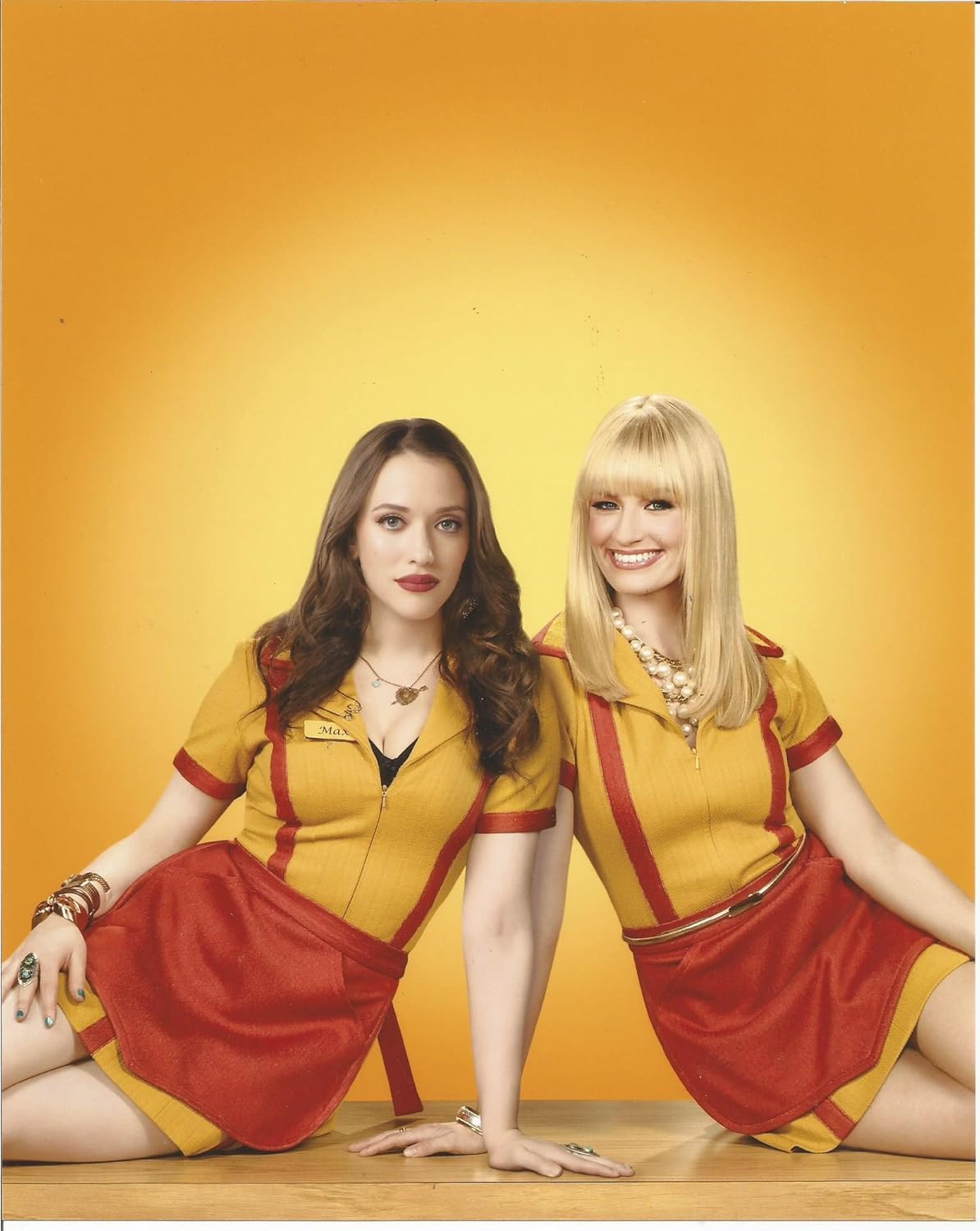 2 Broke Girls Kat Dennings, Beth Behrs sitting on floor in waitressing ...