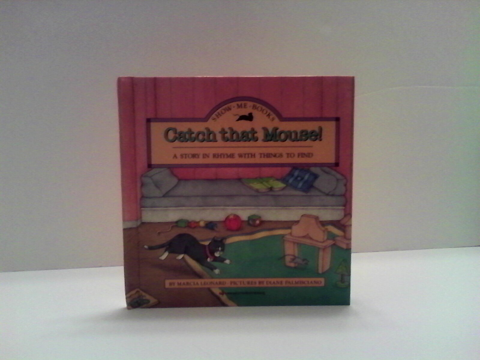 Catch that mouse!: a story in rhyme with things to find by Marcia ...