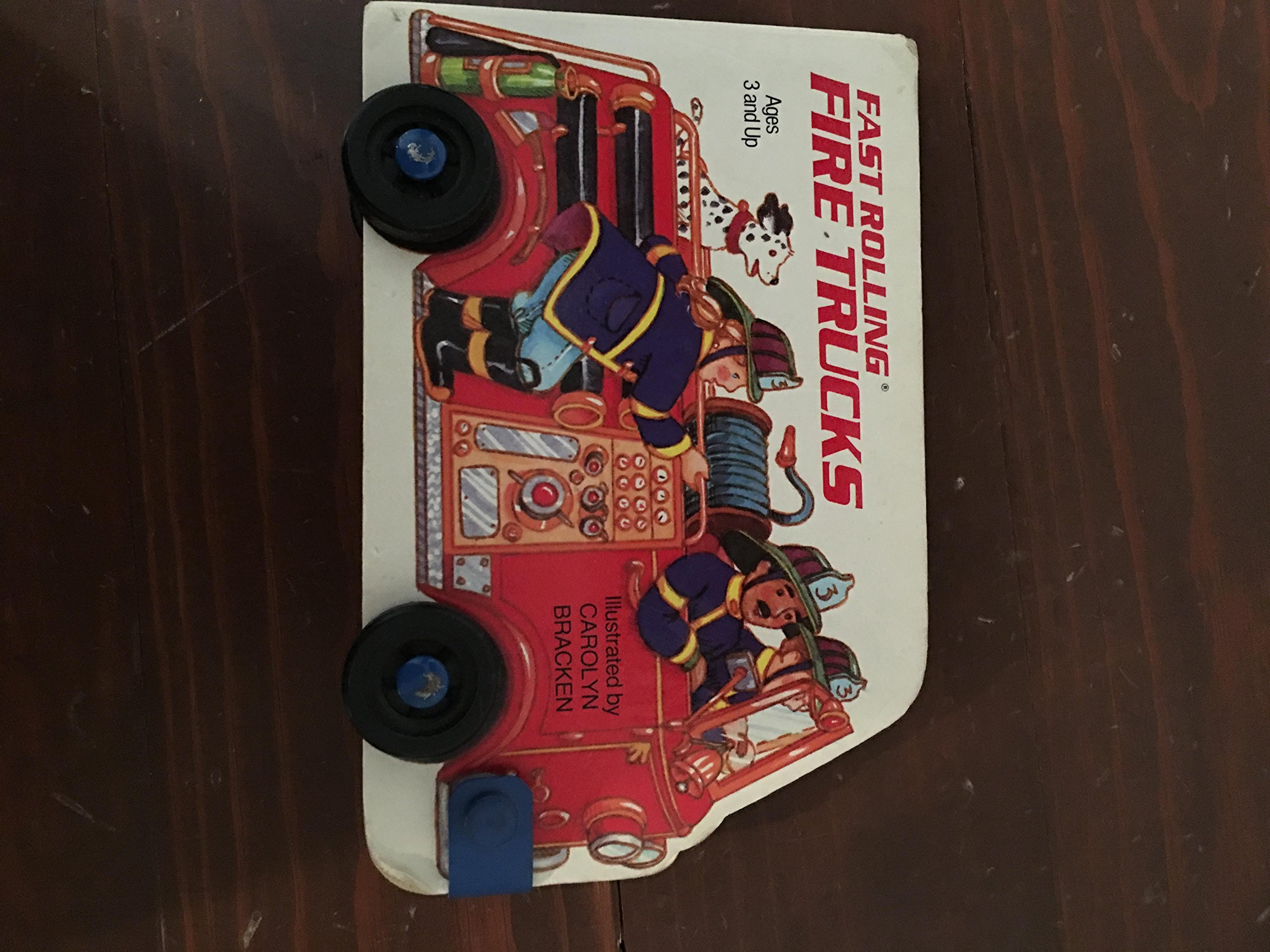 Fast Rolling Fire Trucks (Fast Rolling Books) by Carolyn Bracken ...