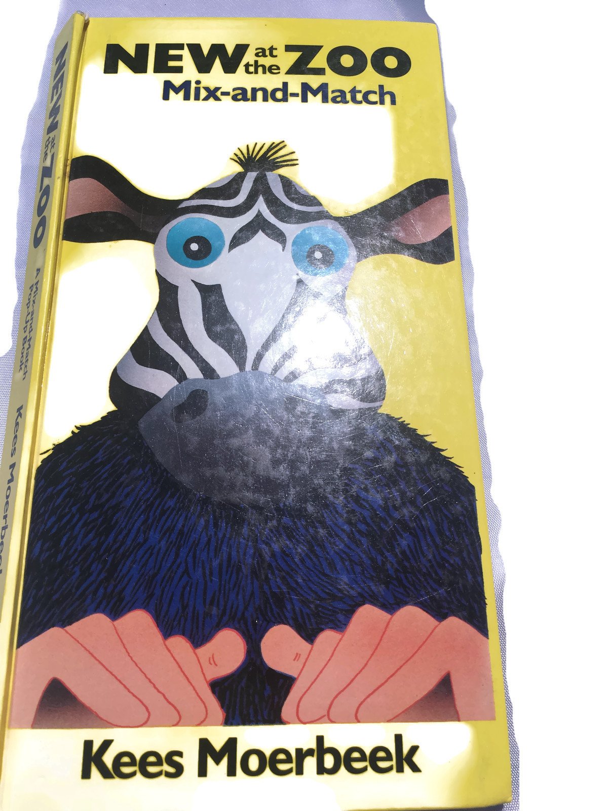 NEW AT THE ZOO (Mix-And-Match Pop-Up Book) by Kees Moerbeek | Goodreads